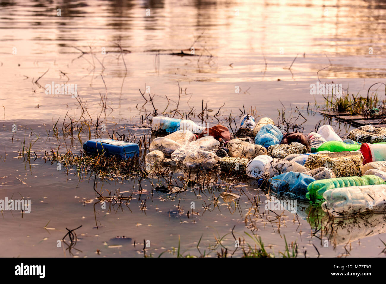Plastic garbage in the river , pollution and environment concept Stock ...