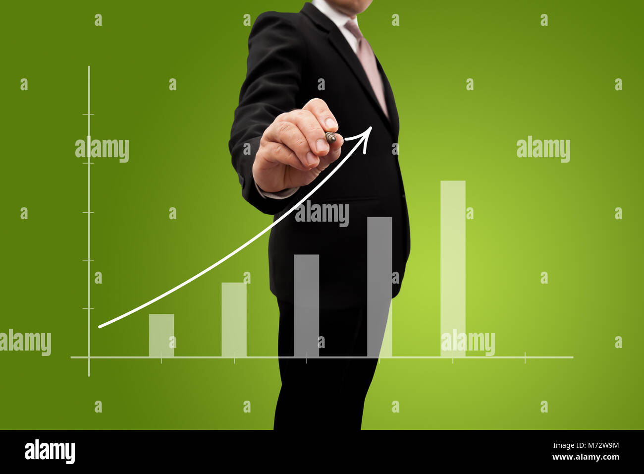 Businessman with growth chart of profits Stock Photo - Alamy