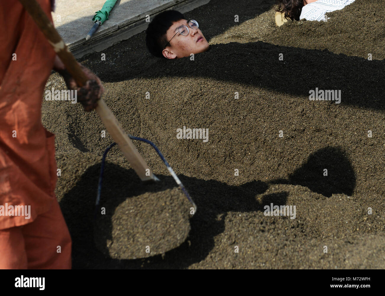 A unique sand bath at Kamegawa onsen by the ocean at Beppu Stock Photo ...