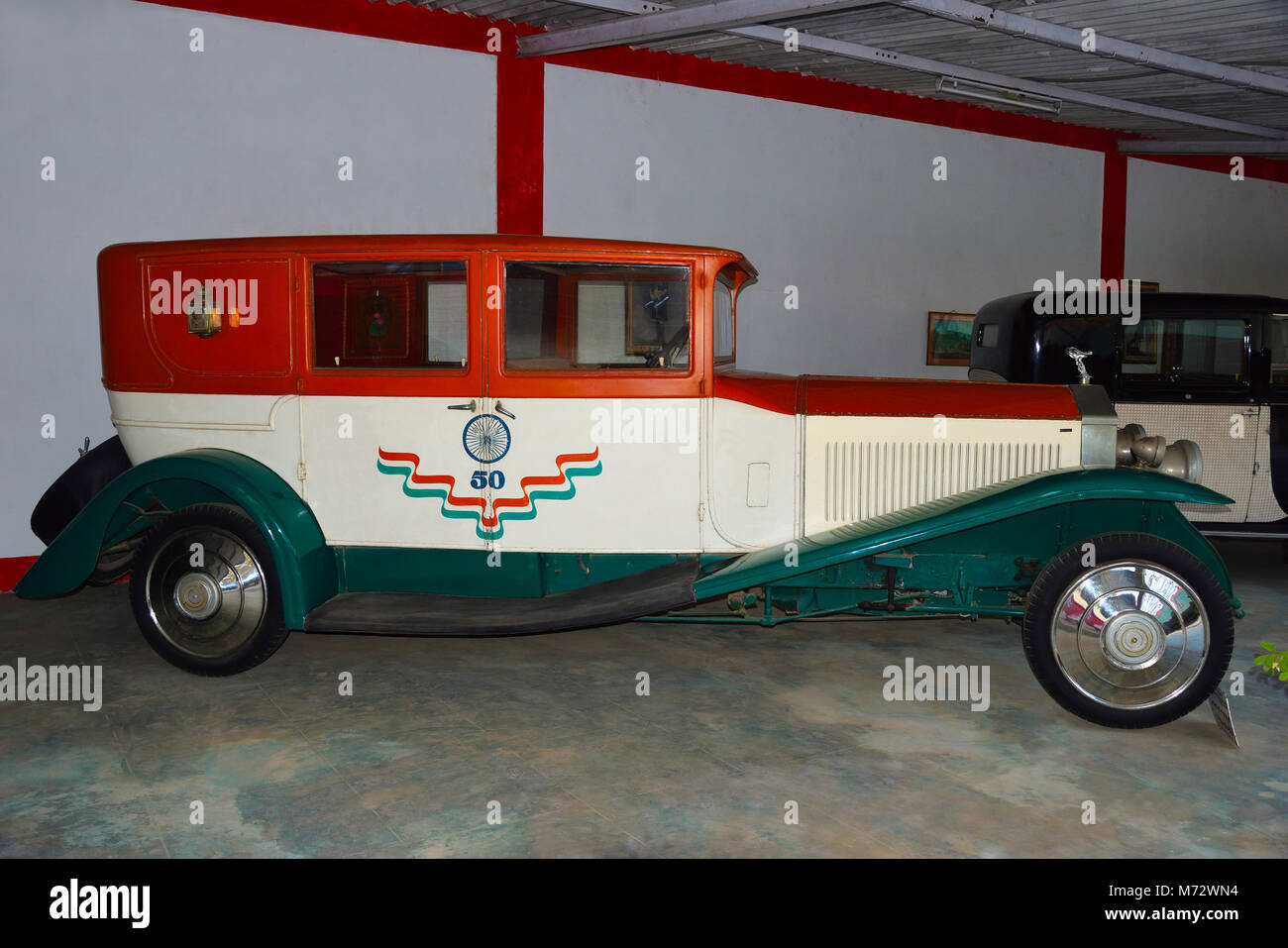 Antique car colored with tricolor and logo of 50th Anniversary of India ...
