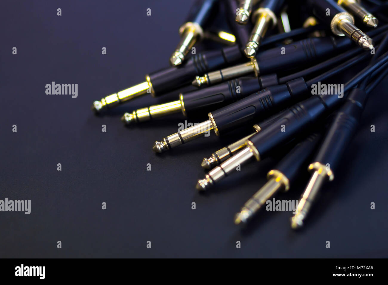 Audio jacks isolated on black background Stock Photo - Alamy