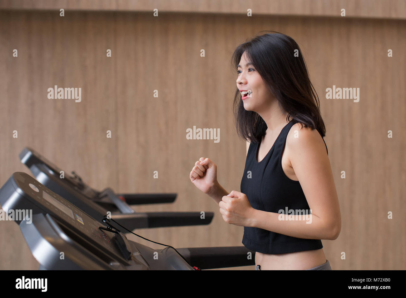 young asian woman workout on treadmill in gym Stock Photo - Alamy