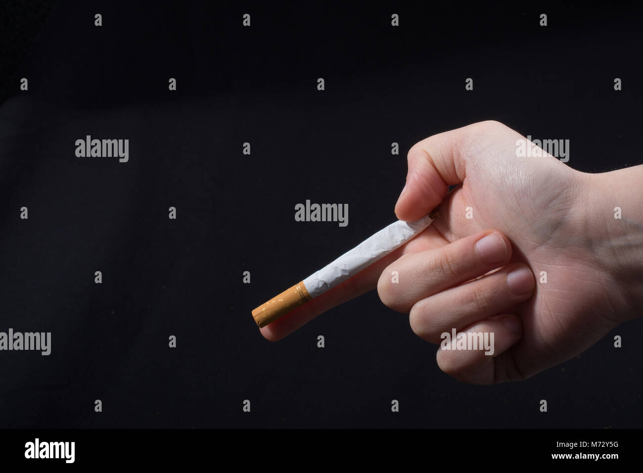 Holding gun cigarette hi-res stock photography and images - Alamy