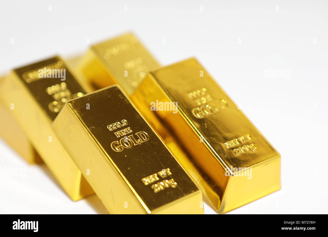 Gold bar pile isolated white background Stock Photo - Alamy