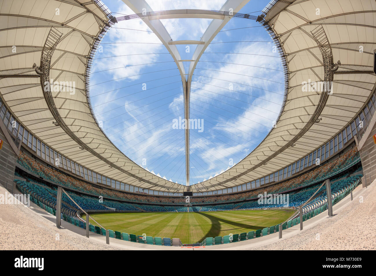 Football stadium grass field and surrounding spectator fan chairs full ...