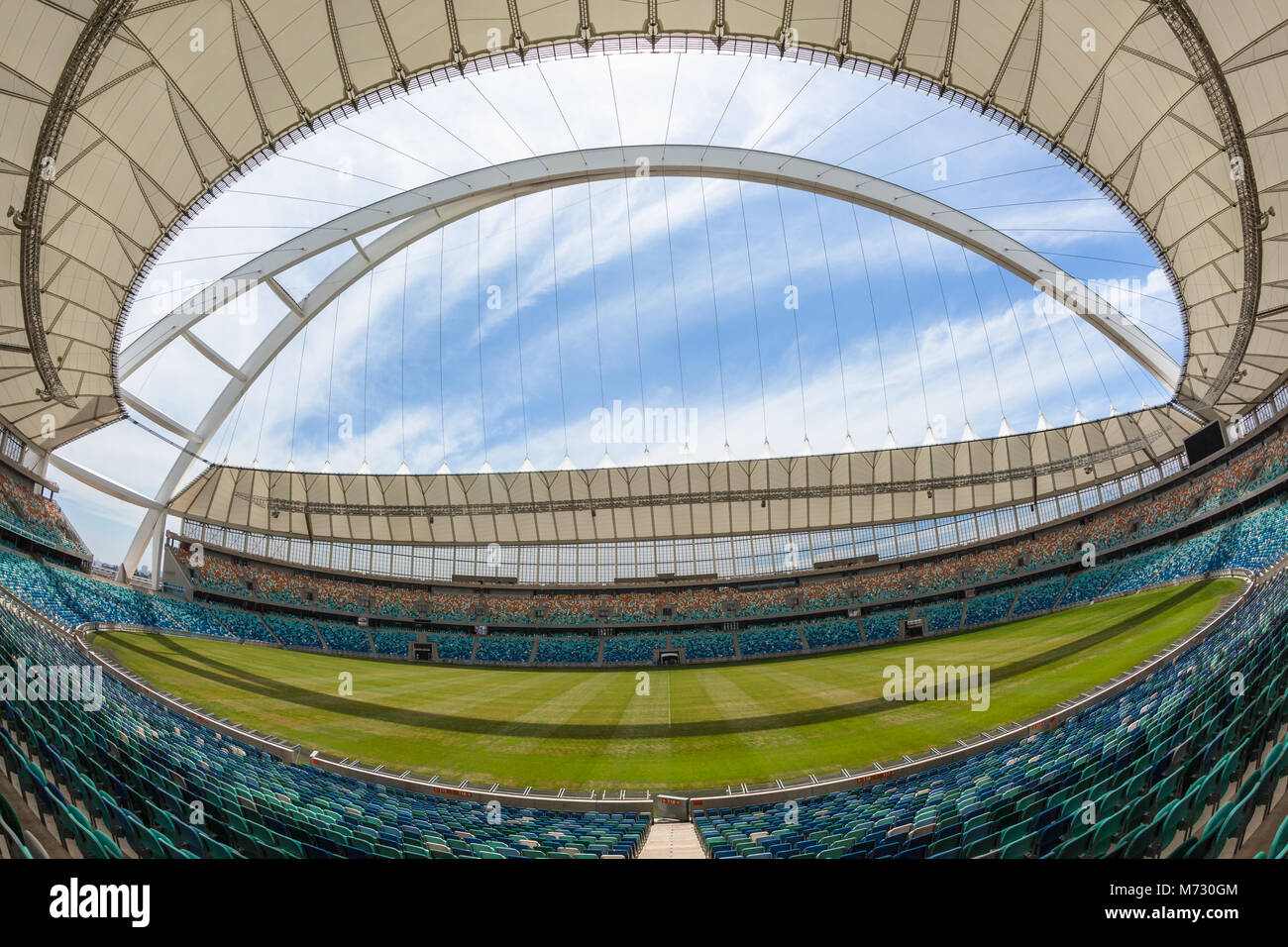 Football stadium grass field and surrounding spectator fan chairs full ...