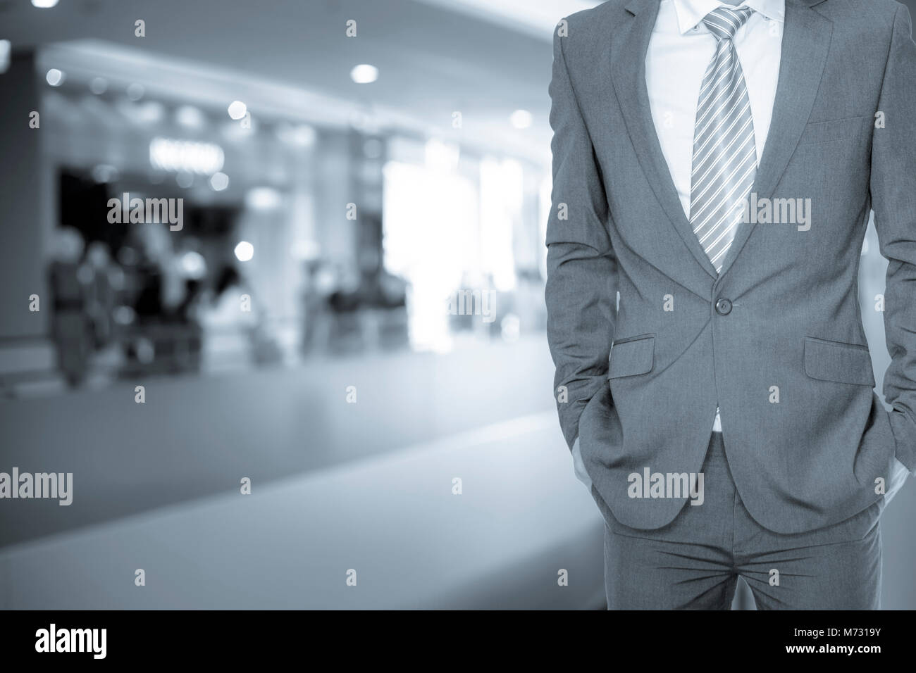 isolated business man on shopping mall background Stock Photo - Alamy