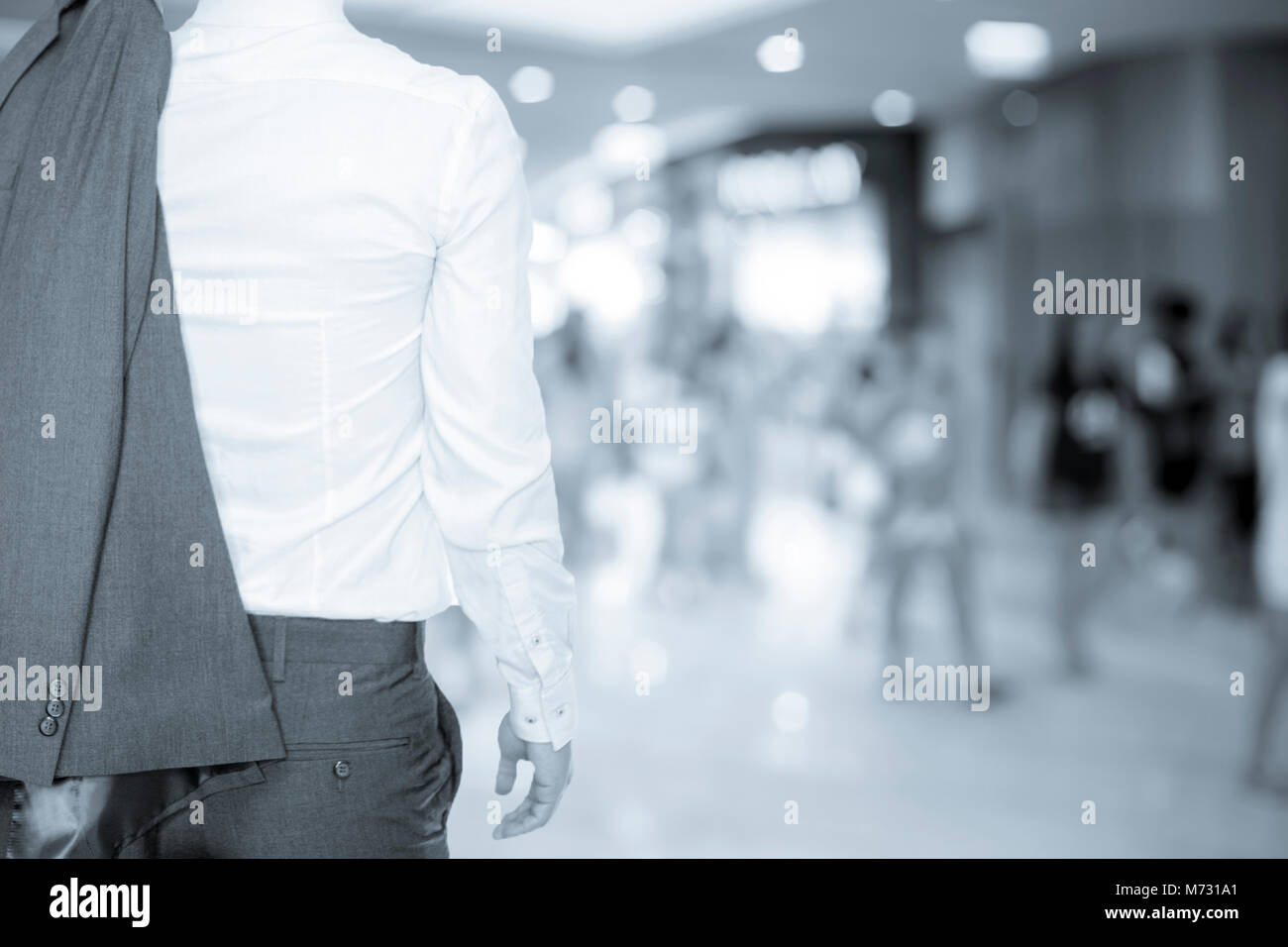 isolated business man on shopping mall background Stock Photo - Alamy