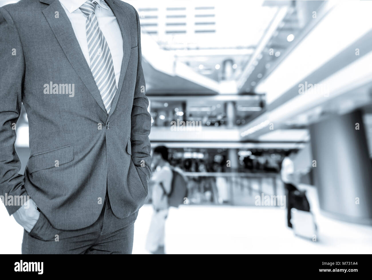isolated business man on shopping mall background Stock Photo - Alamy