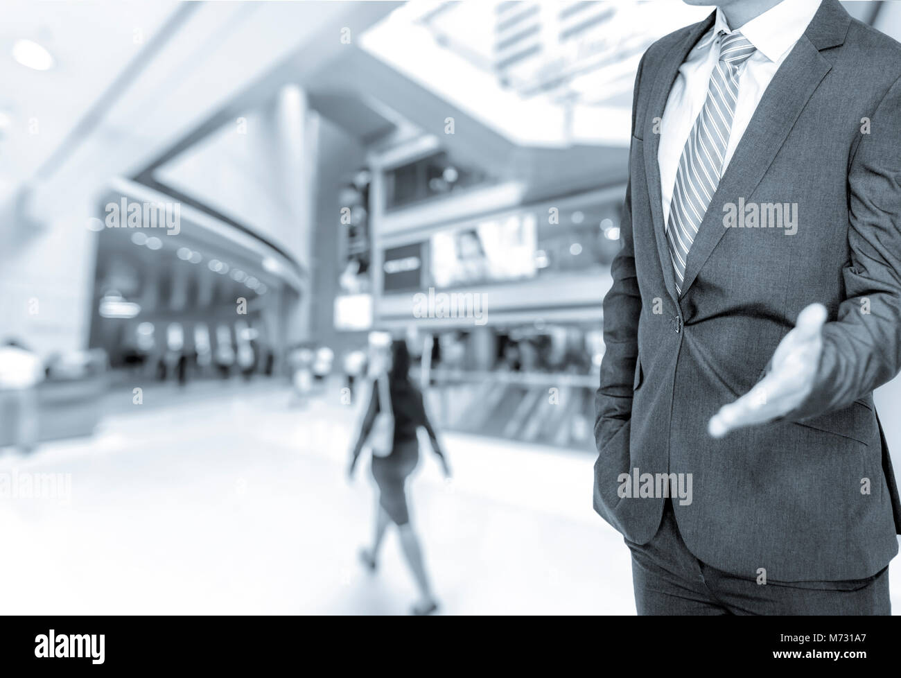 isolated business man on shopping mall background Stock Photo - Alamy