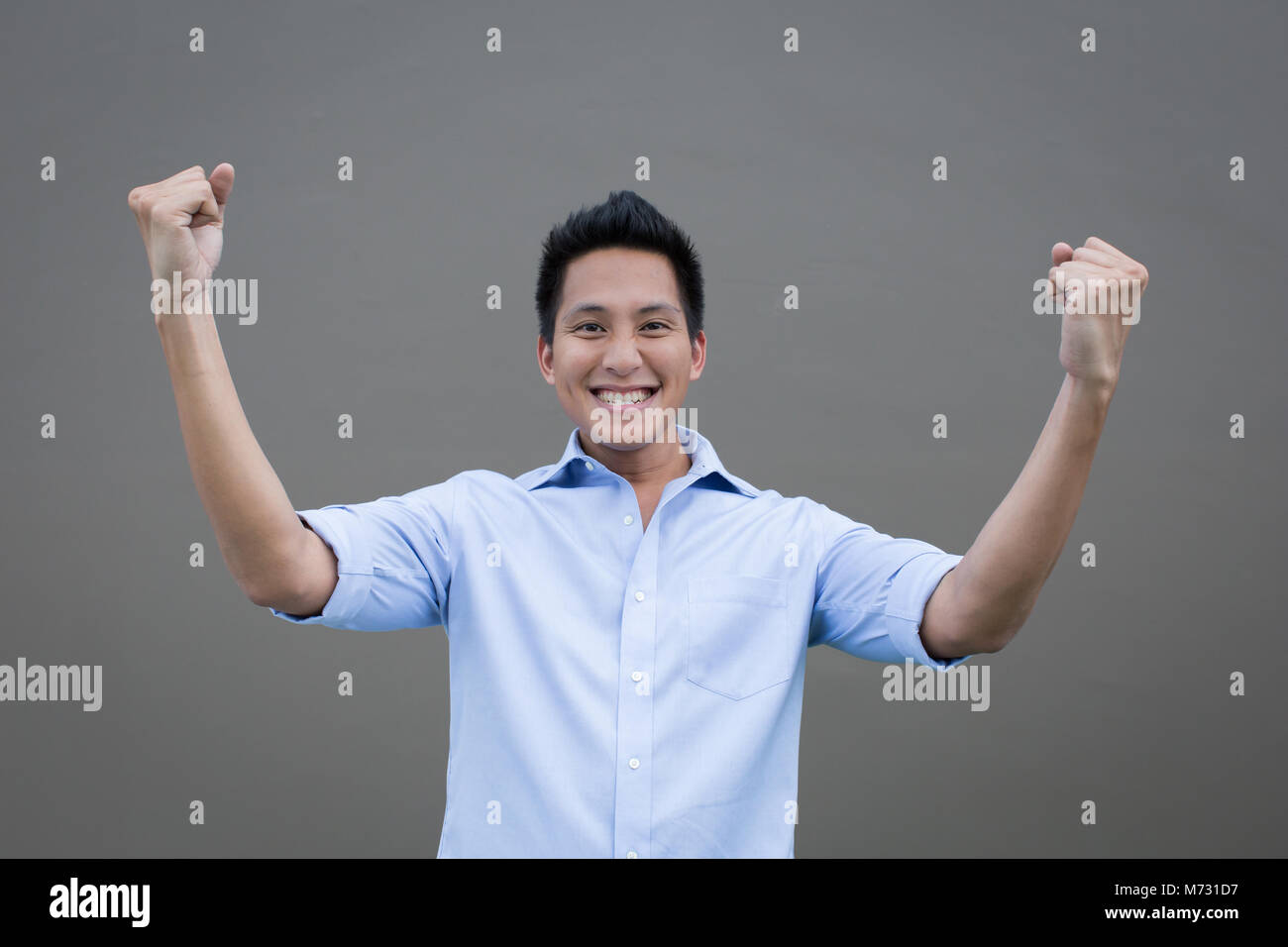 asian man success concept with hands up on sky Stock Photo - Alamy