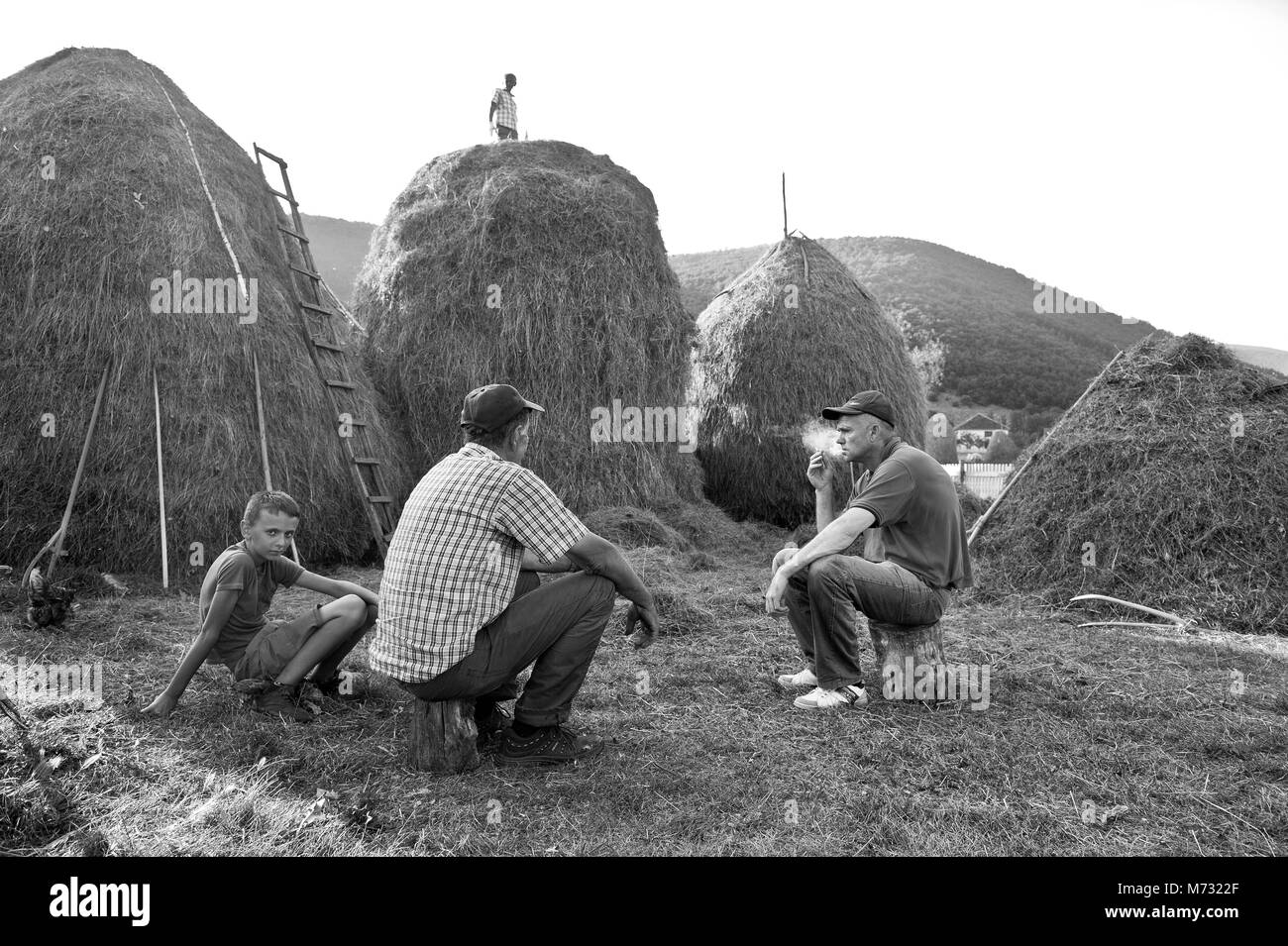 Scenic Black And White Image Of Farmers Having A Rest During The scenic-black-and-white-image-of-farmers-having-a-rest-during-the