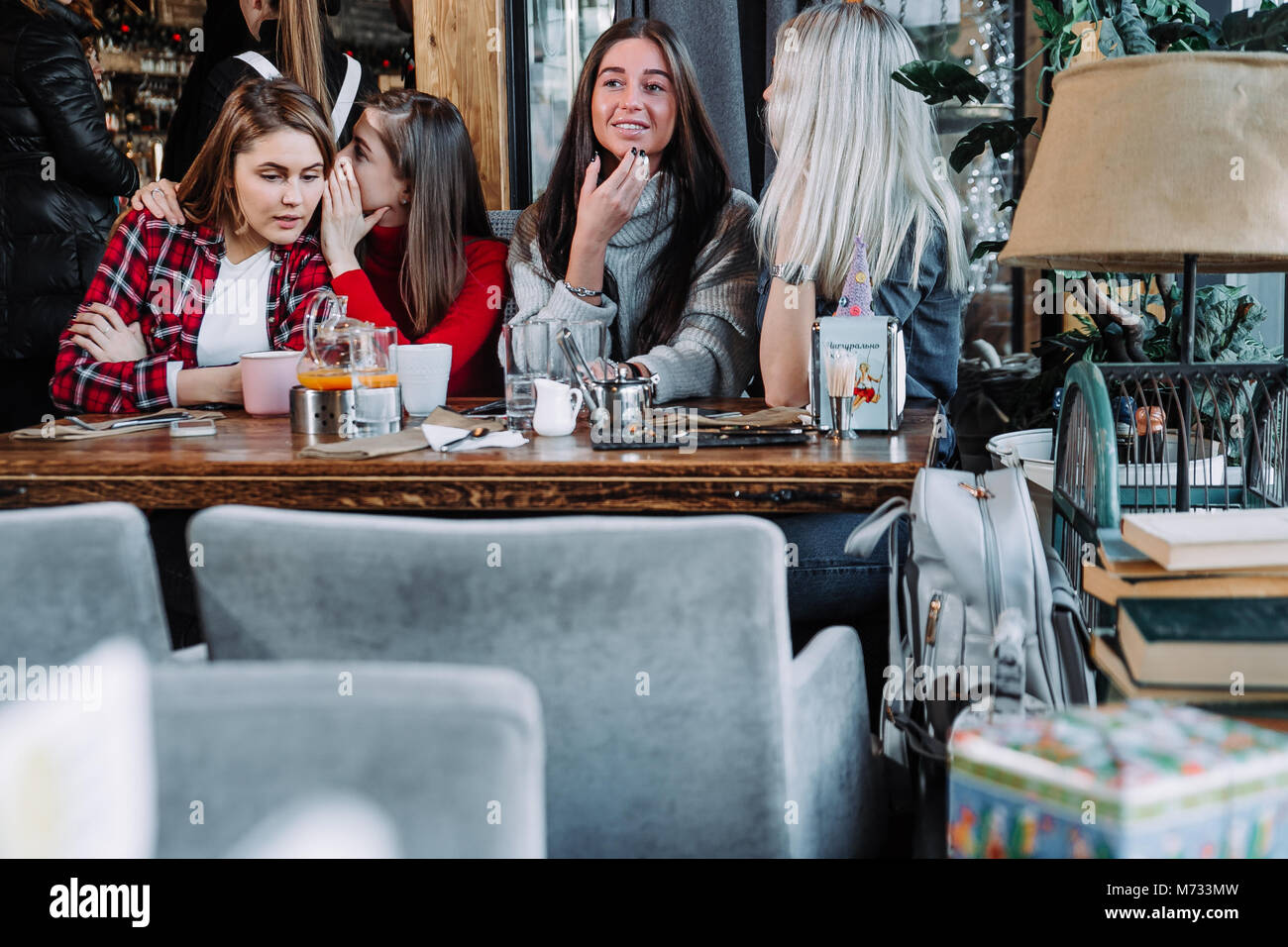 four friends gossiping in a cafe Stock Photo - Alamy
