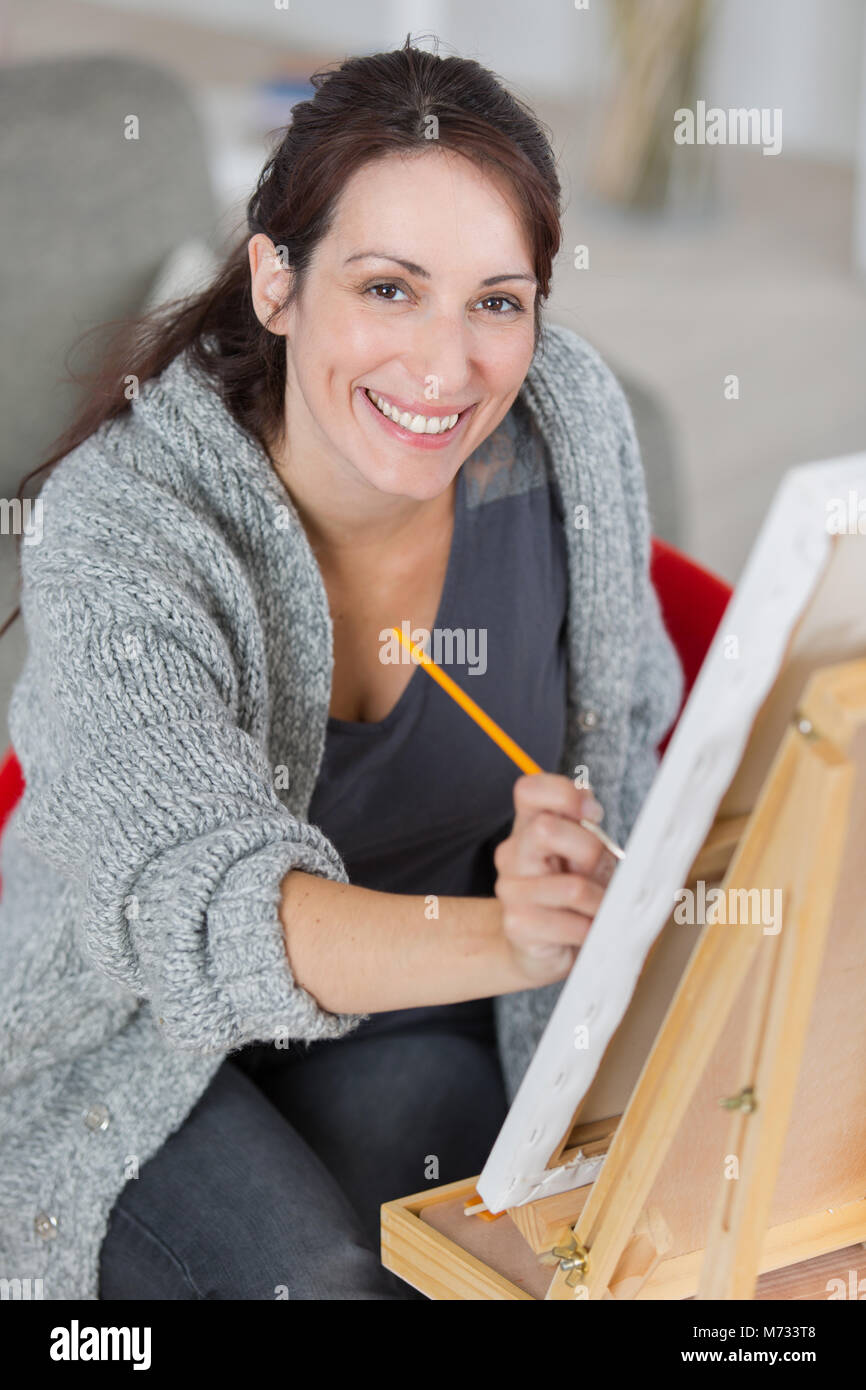 happy female painter working Stock Photo - Alamy