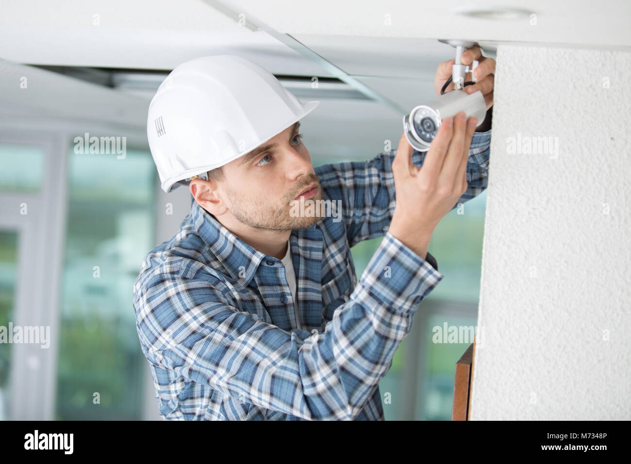 professional cctv technician working Stock Photo - Alamy