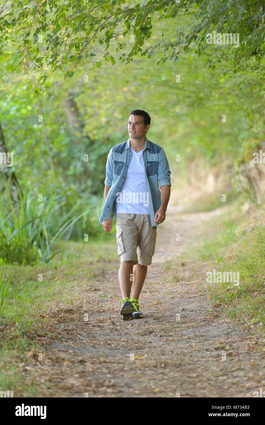 man walking in the forest Stock Photo - Alamy