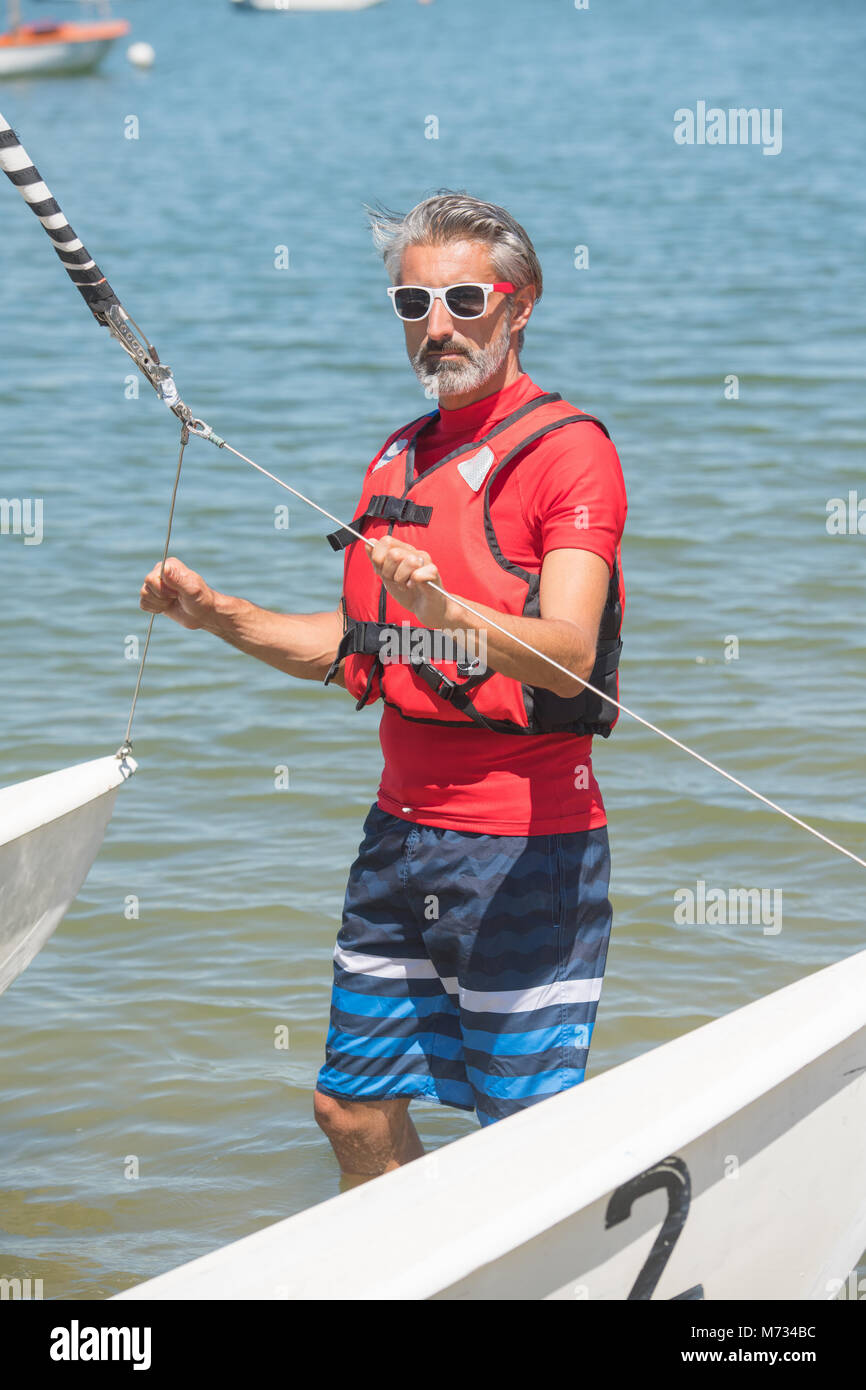 professional waterman training on lake with catamaran Stock Photo - Alamy