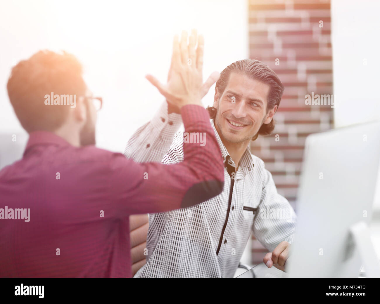 Businessman giving high five to his partner.concept of teamwork Stock ...