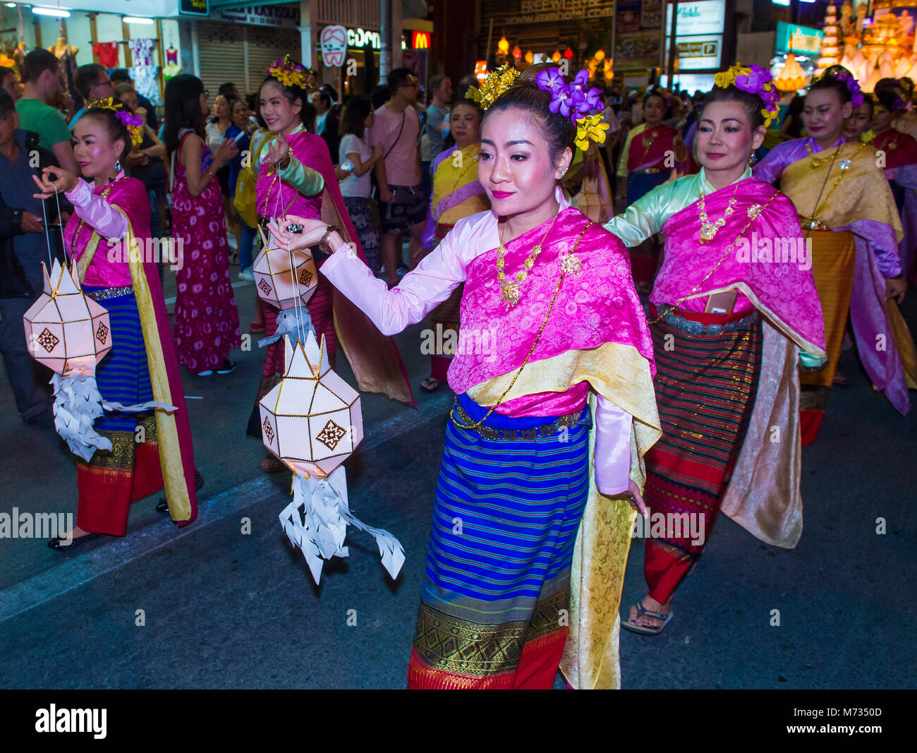 Participants in a parade during Yee Peng festival in Chiang Mai ...