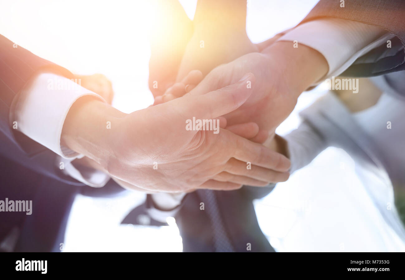 closeup.business people folding their hands together Stock Photo - Alamy