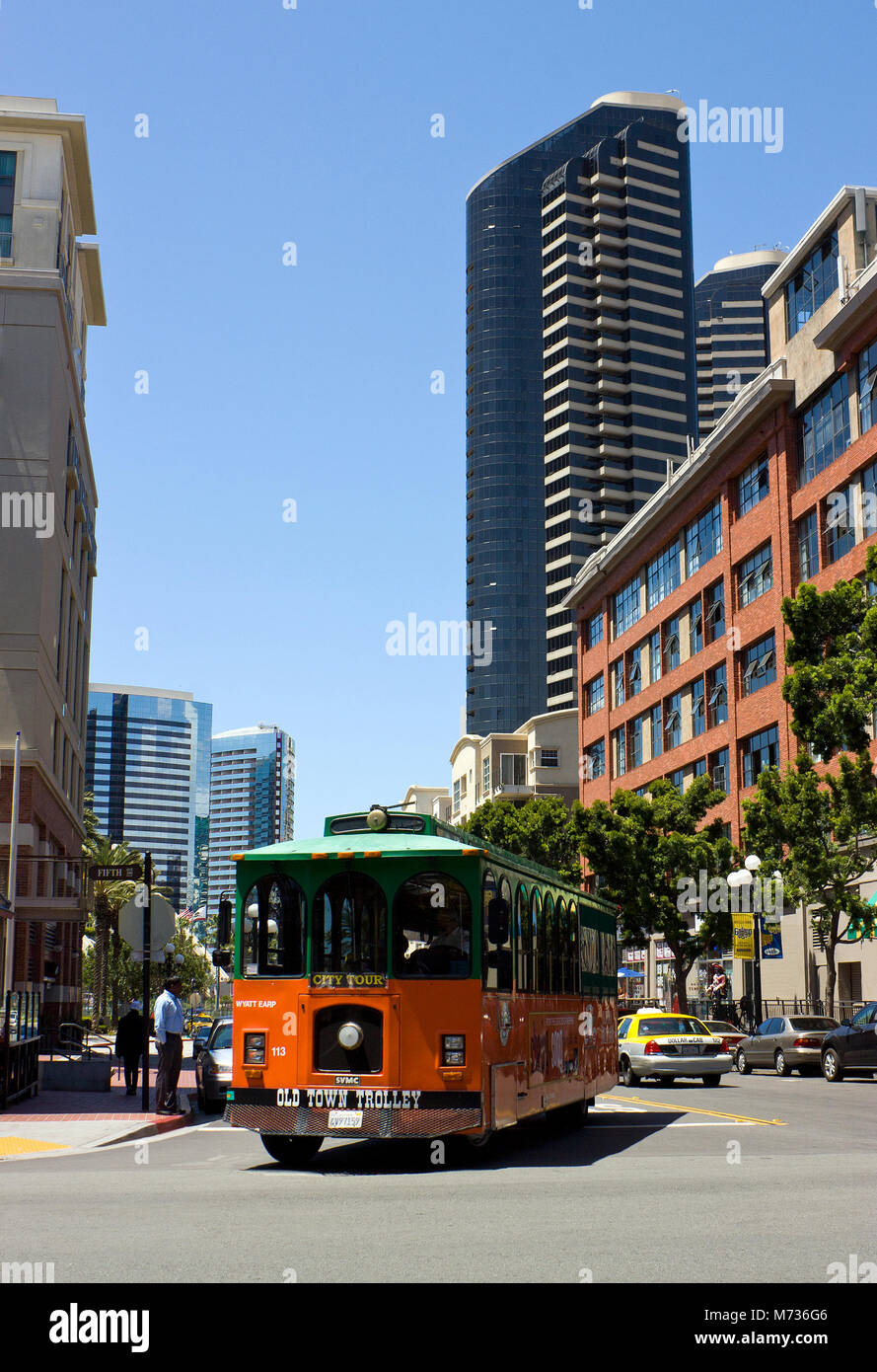 The bus of the orange line rolls along the central street San Diego ...