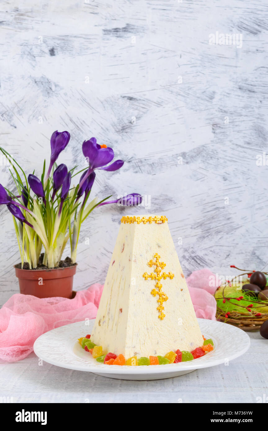 Traditional curd Easter cake with candied fruits and chocolate eggs ...