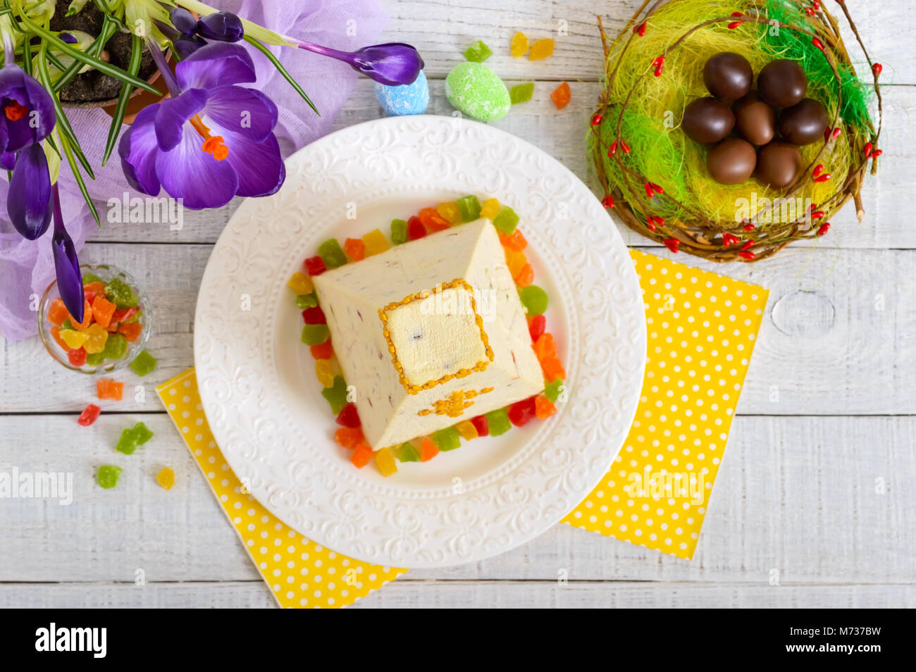 Traditional curd Easter cake with candied fruits and chocolate eggs ...