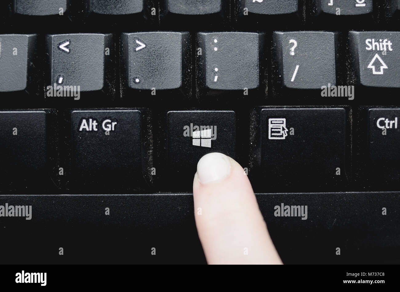 Brazil - March 02, 2018: Finger pressing the Windows key from a dusty ...
