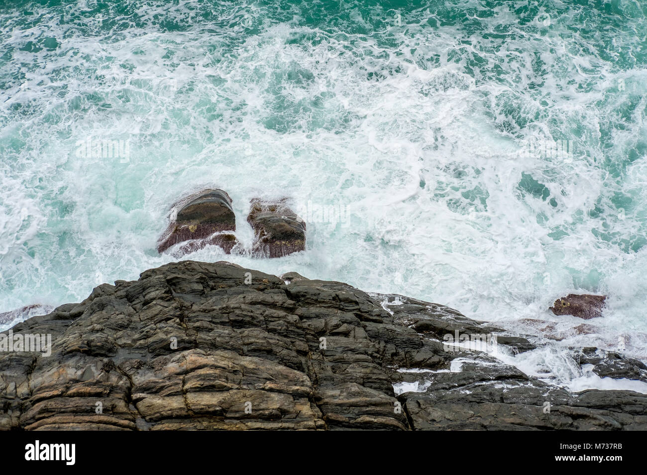 Sea waves crashing on the rock Stock Photo - Alamy