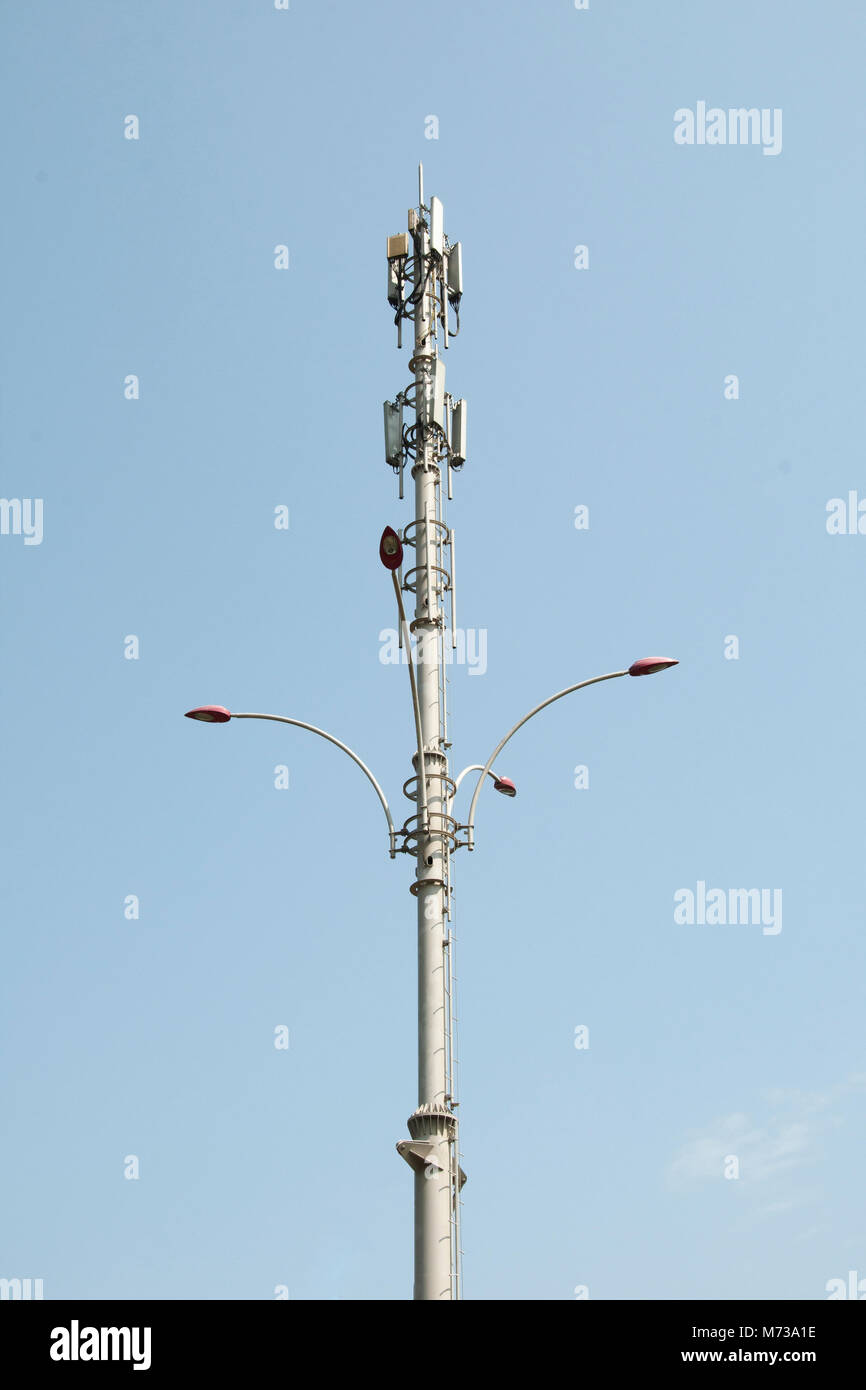 Telecommunications repeater tower against a clear blue sky Stock Photo ...