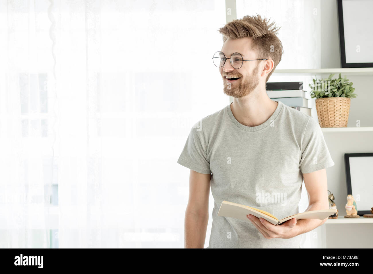 Men read hi-res stock photography and images - Alamy