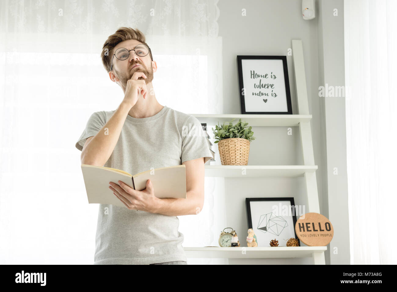 men read book in livingroom with in morning Stock Photo - Alamy