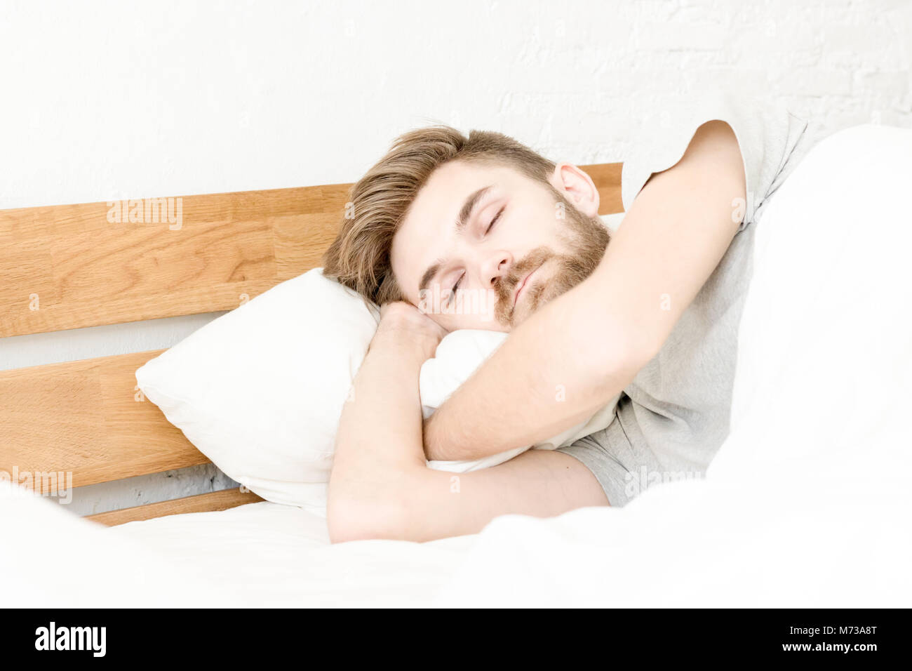 Men sleep on bed in the morning with in bedroom Stock Photo - Alamy