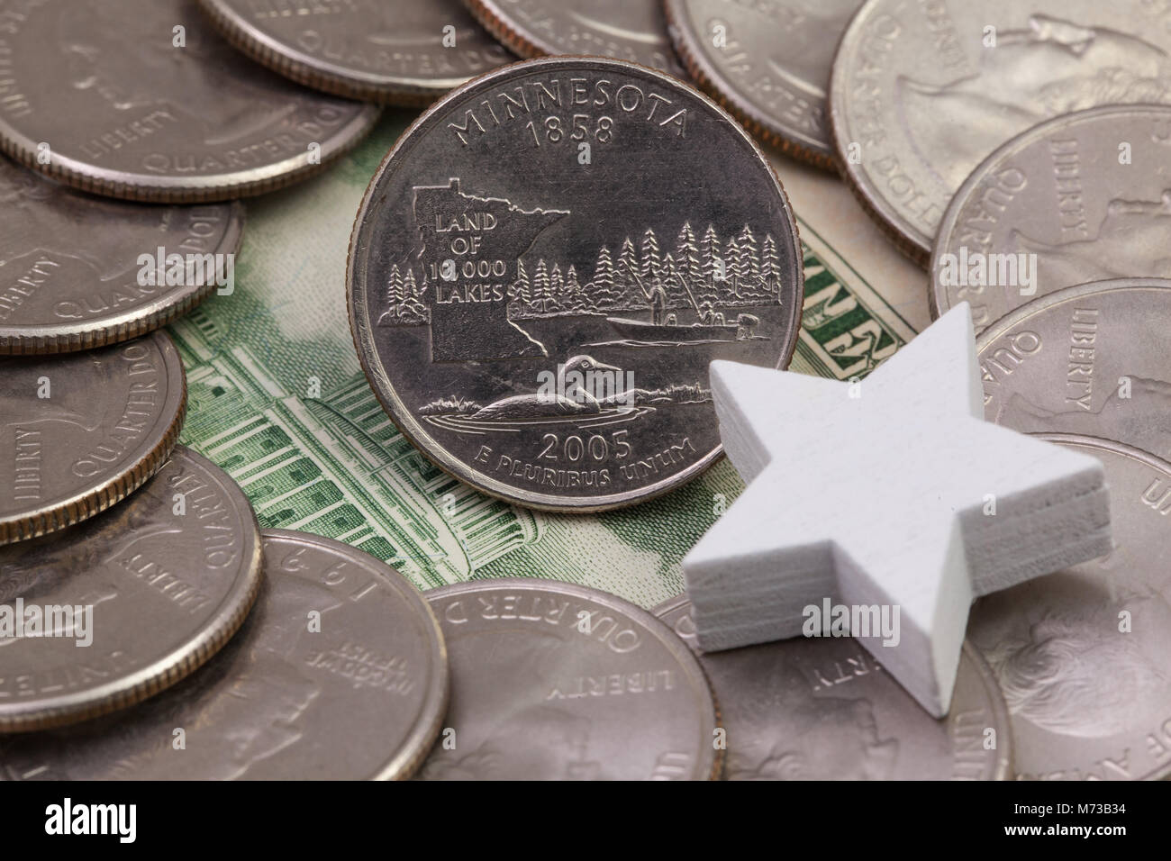 A quarter of Minnesota, quarters of USA and white star. A circle of the ...