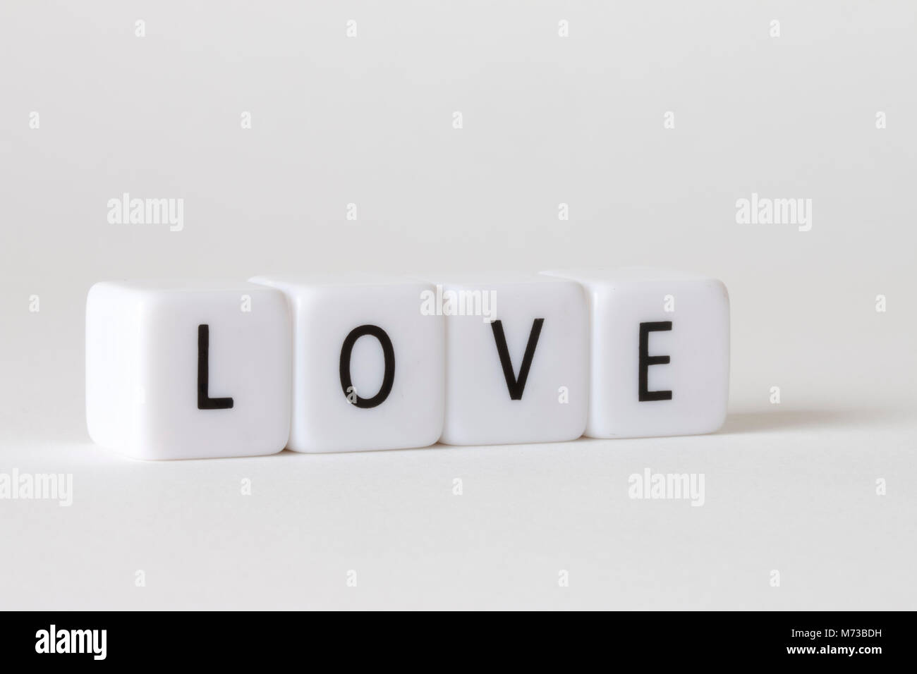 White cube written as LOVE Stock Photo - Alamy