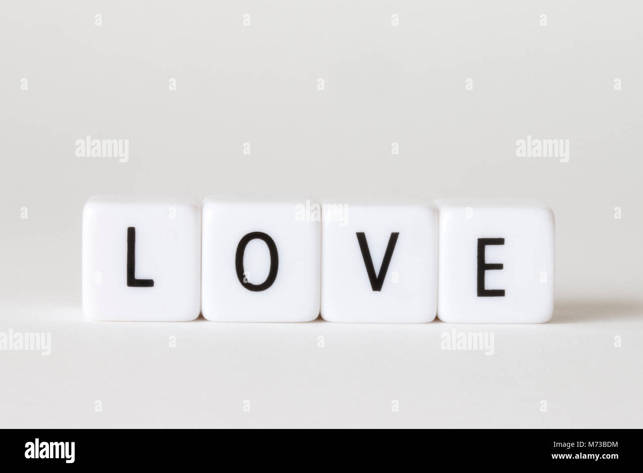 White cube written as LOVE Stock Photo - Alamy