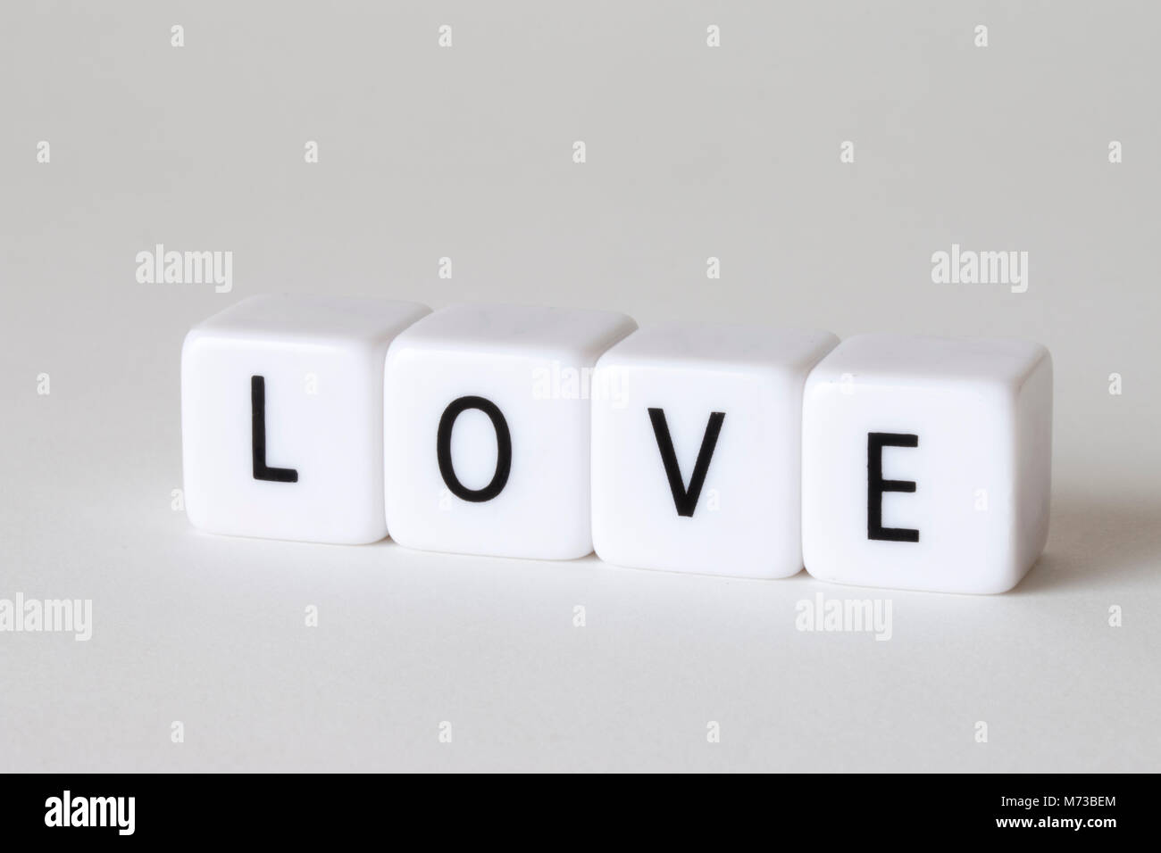 White cube written as LOVE Stock Photo - Alamy