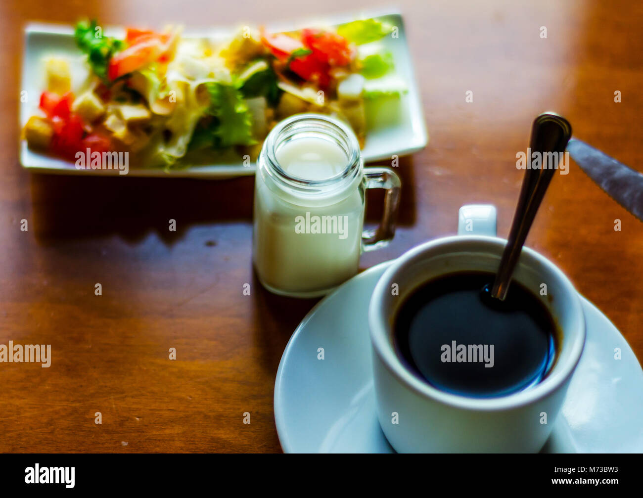 black coffee with set appetizers in small portions, healthy and ...