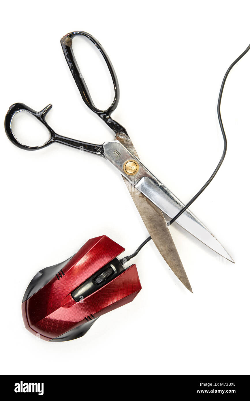 Computer mouse with black cable and scissors. Cut out or wireless ...