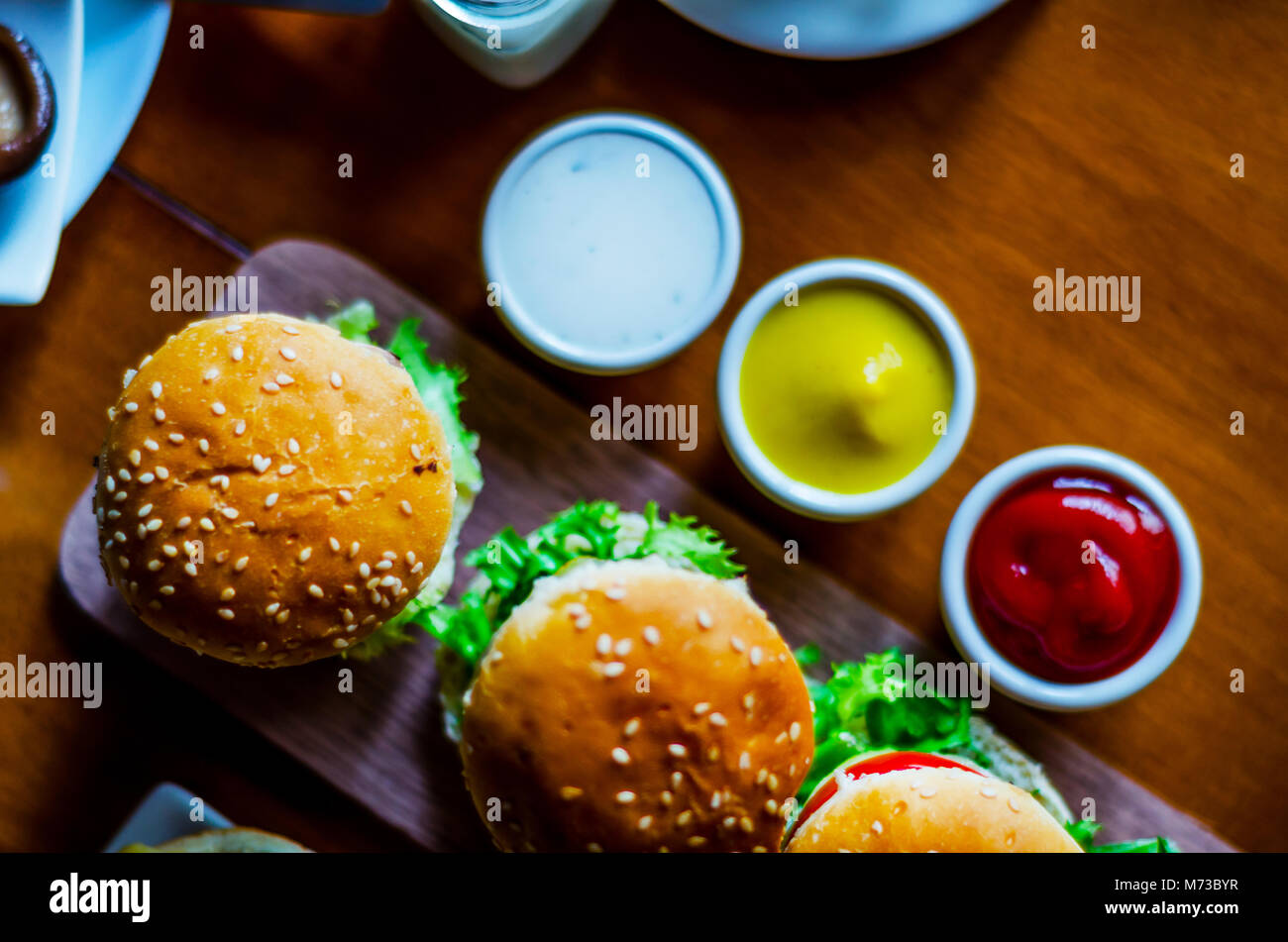 mini burgers with meat, vegetables, cheese and other toppings, bread ...