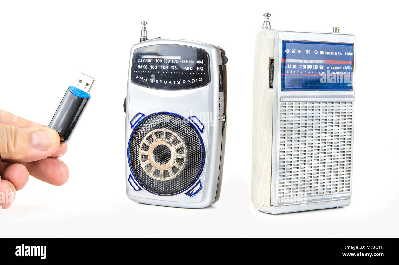 Old and small transistor radio on battery with USB key Stock Photo - Alamy