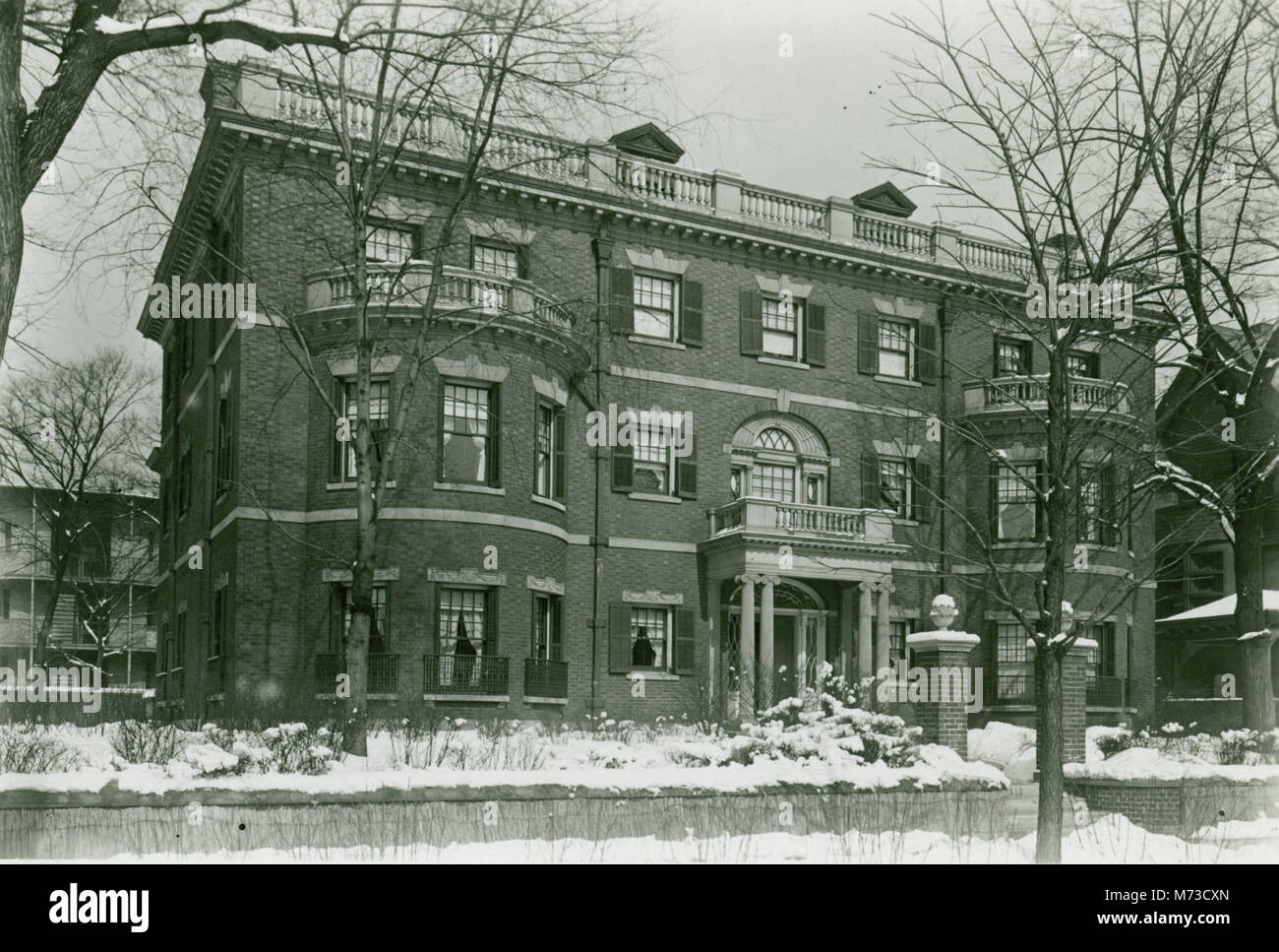 This photograph shows a Colonial-style house in Chicago from the early ...