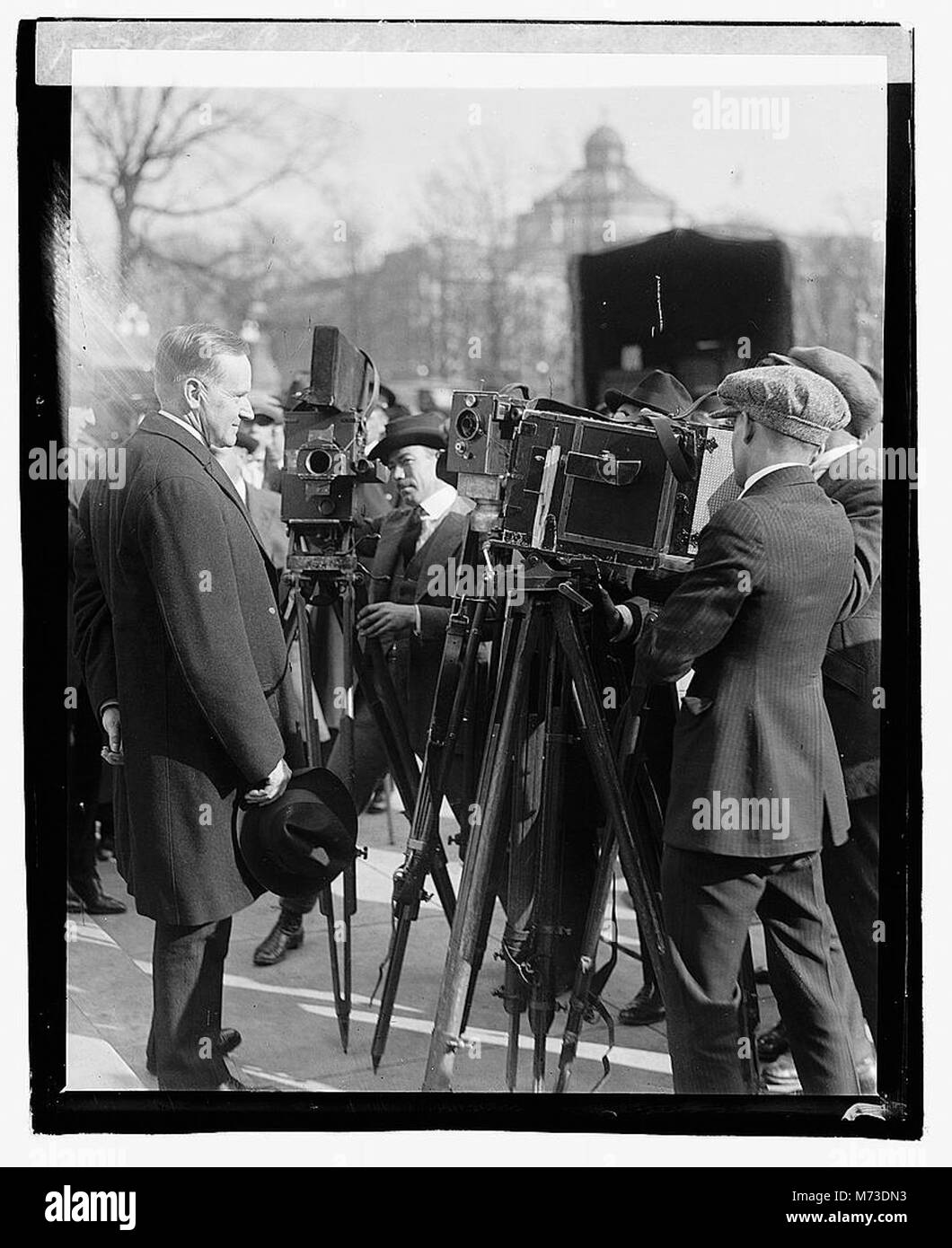 The image depicts a notable figure, Coolidge, likely referring to ...