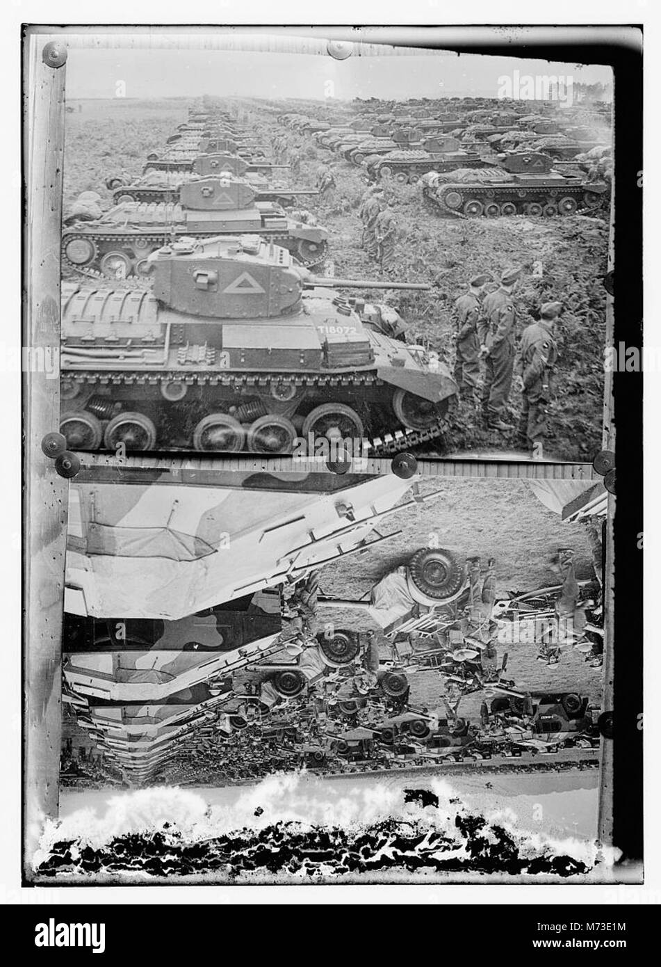 The photograph shows a military scene featuring tanks and soldiers ...