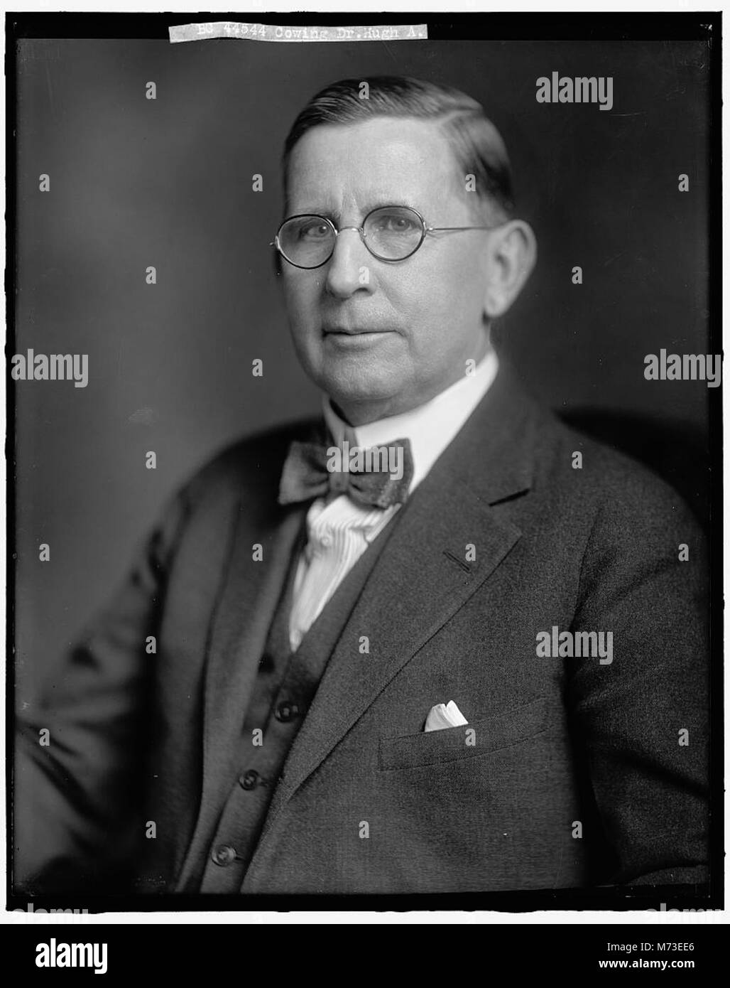 A formal portrait of Dr. Hugh A. Cowing, showcasing him as a respected ...
