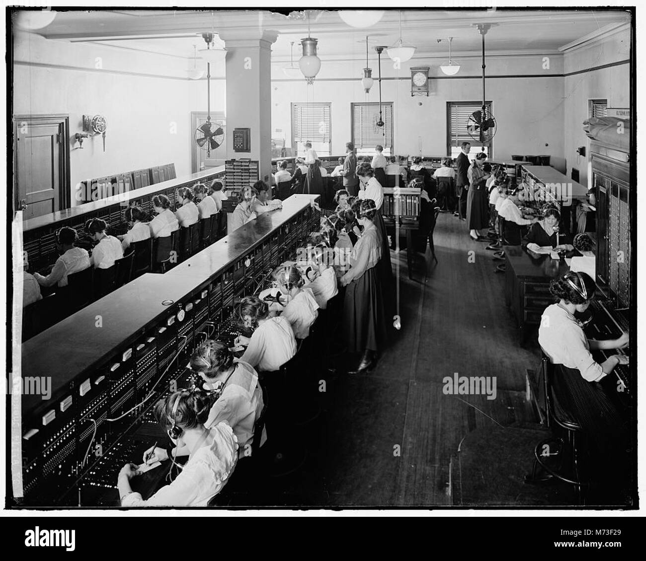 A historic photograph showing the switchboards at the C & P Telephone ...
