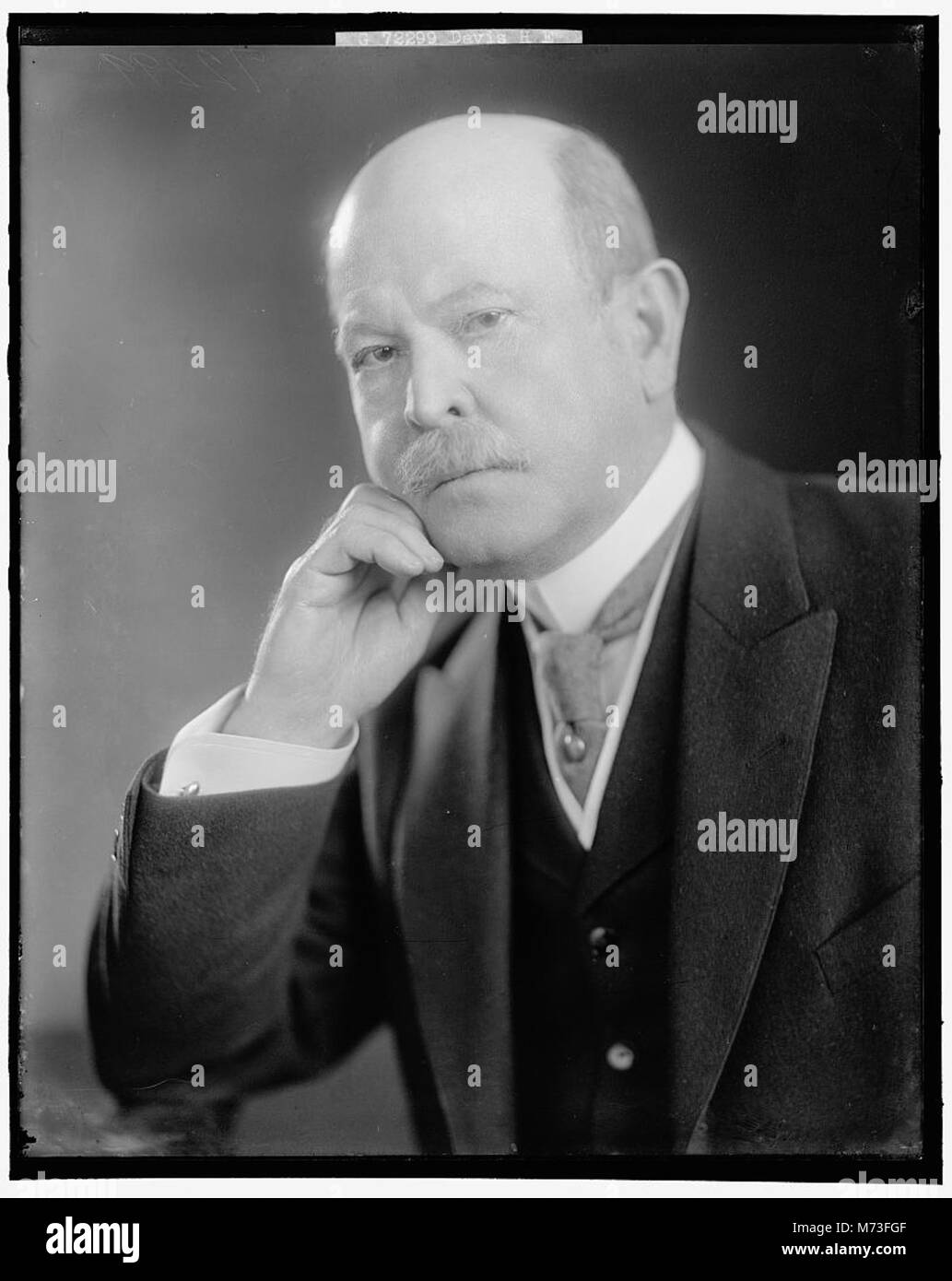 A formal portrait of H.E. Davis, showcasing his role as a notable ...