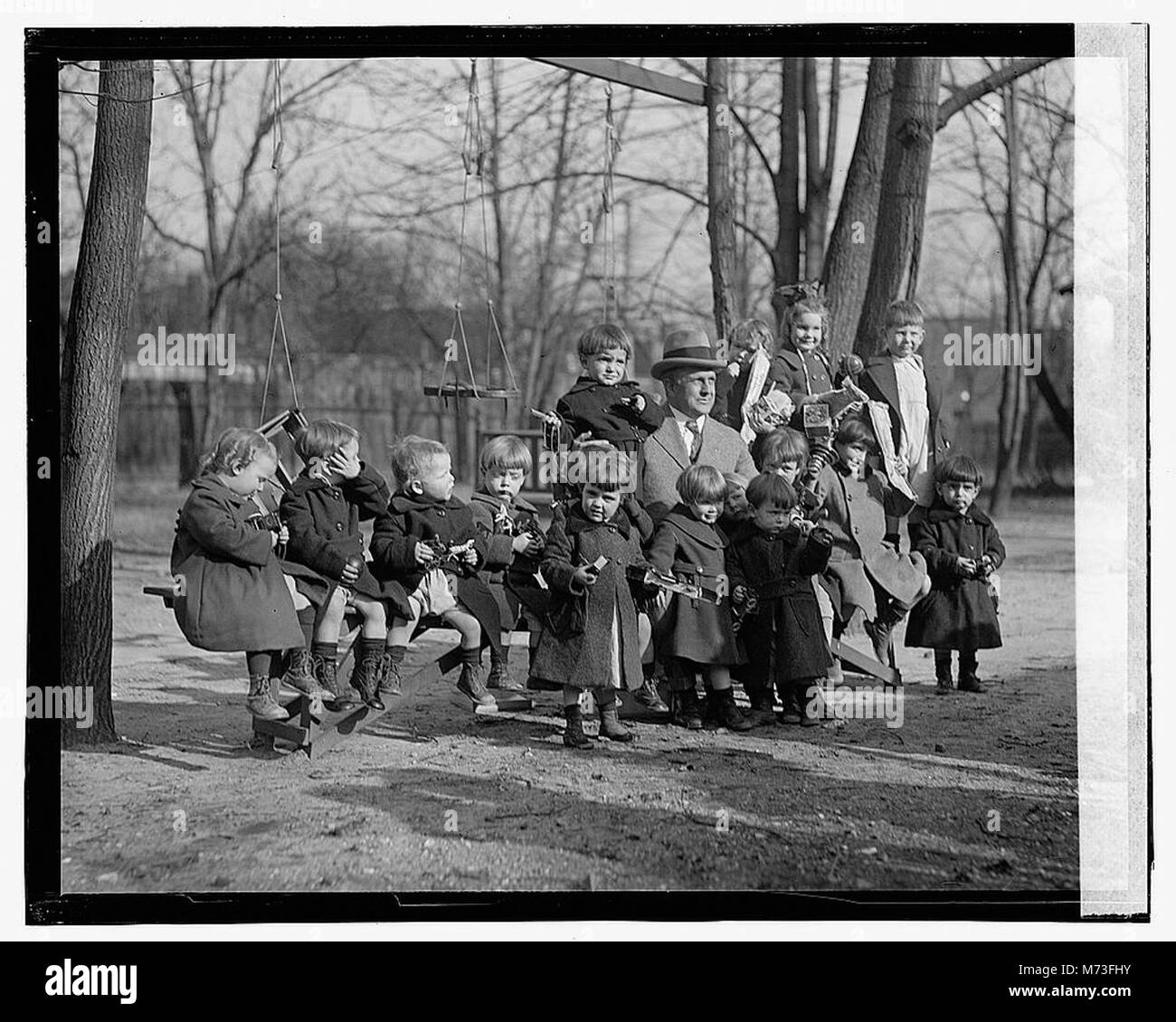 A photograph from 1922 showing Davis with a group of orphans, captured ...