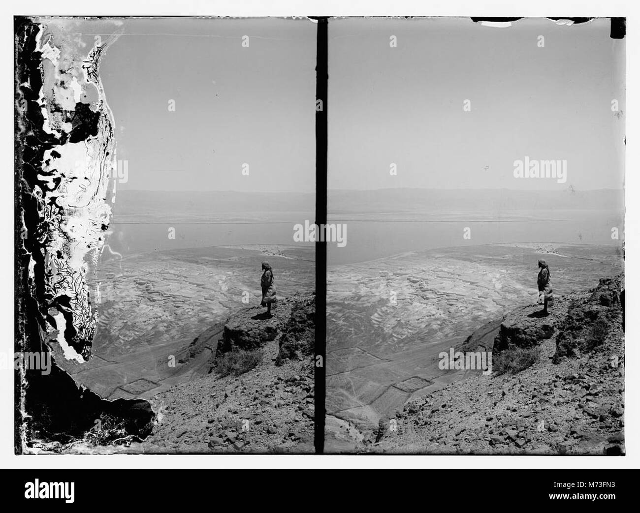 This photograph depicts the Dead Sea, a saltwater lake bordered by ...
