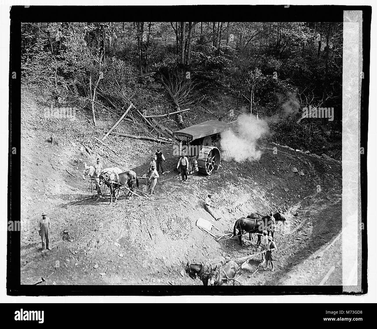 A photograph of workers digging a new conduit on October 3, 1922 ...